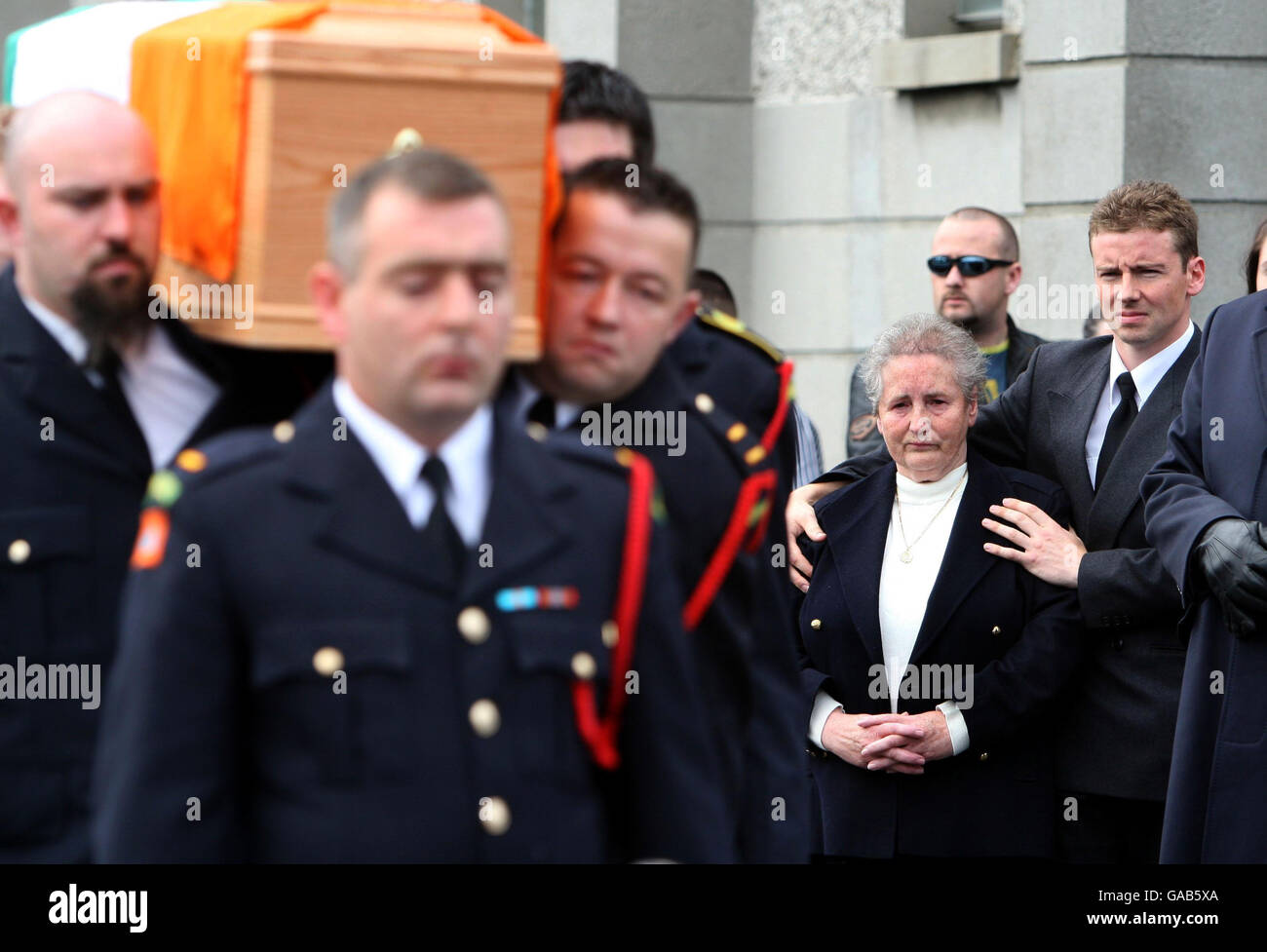 Fireman Mark O'Shaughnessy's mother Marie and brother Eamonn follow his ...