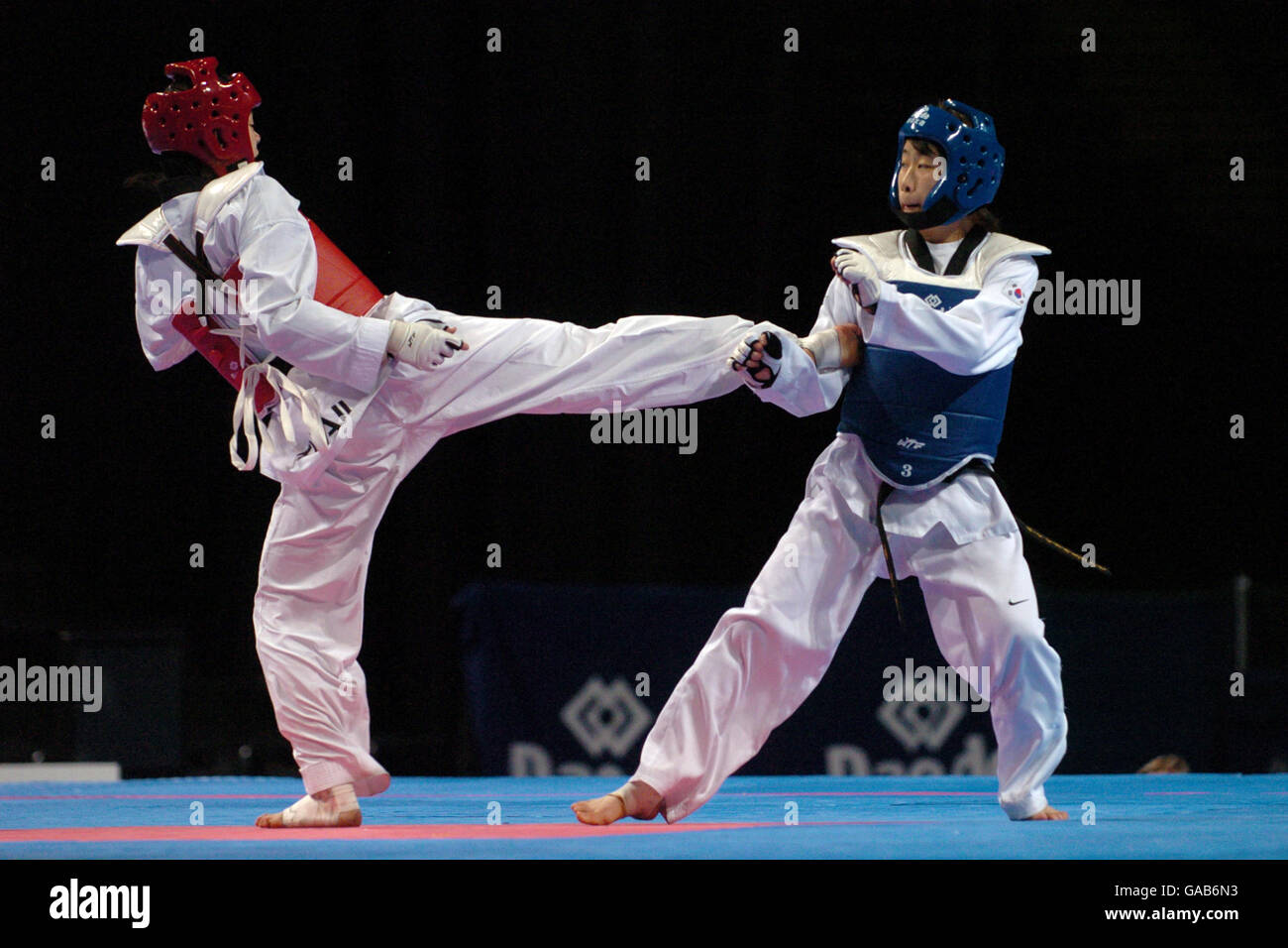 South Korea's Lim Su Jeong (blue) in action against Thailand's Premwaew ...