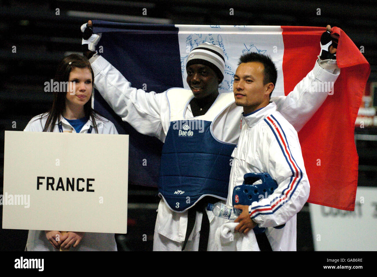 France's Gwladys Epangue (c) celebrates winning against South Korea's ...