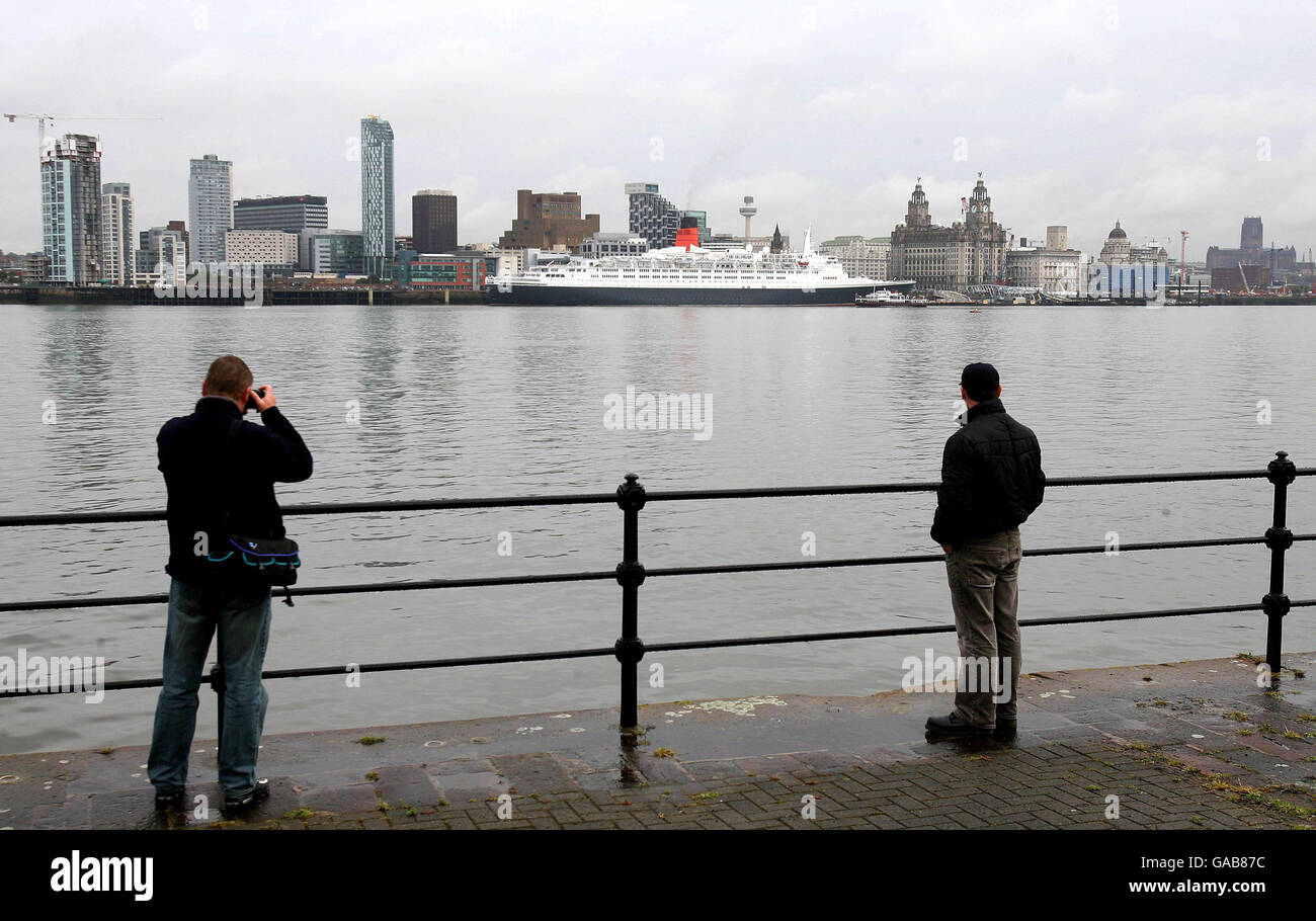 The QE2 sits docked on the River Mersey in Liverpool today as part of ...