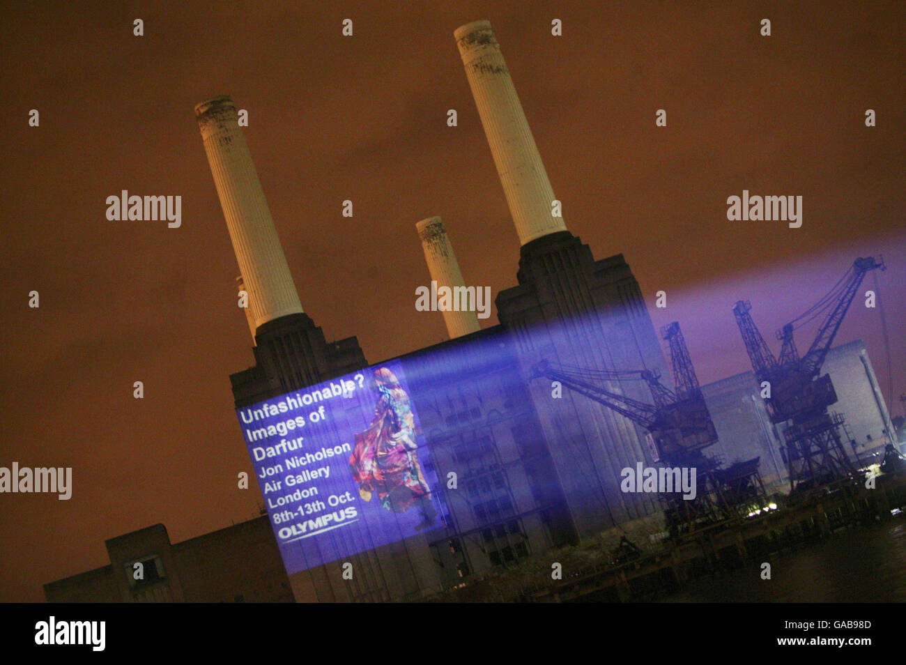 An image of a Darfuri woman is projected on the side of Battersea Power ...