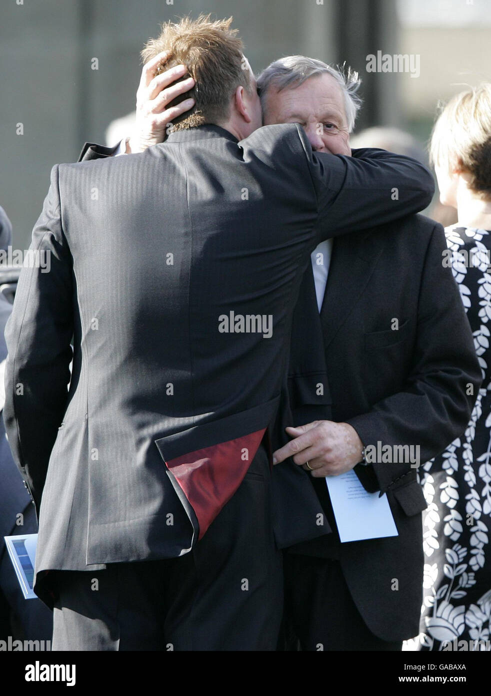 Colin McRae's father, Jimmy, gets a hug after he leaves the funeral of ...