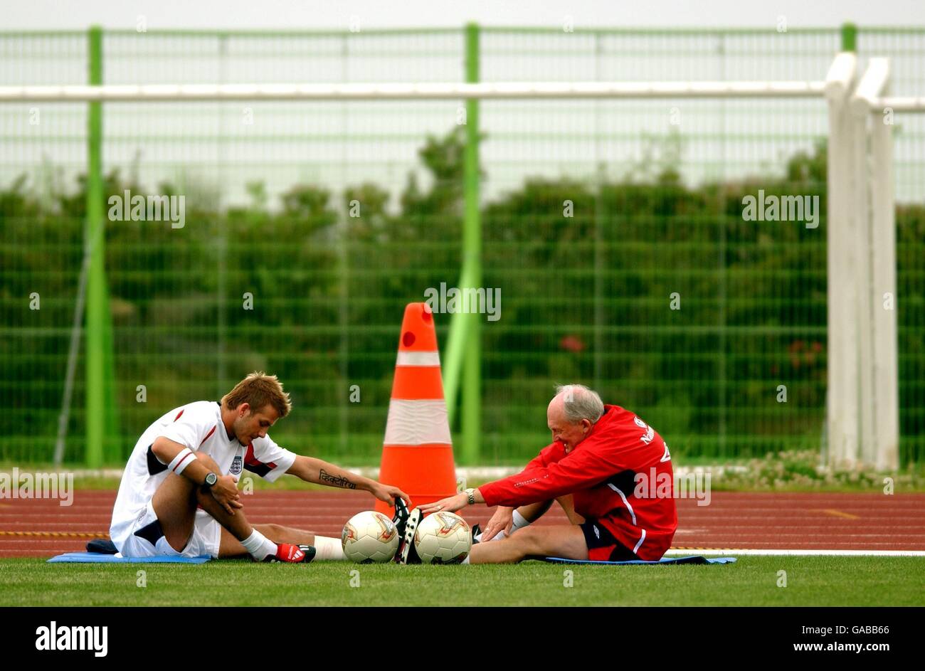 Englands david beckham does stretching exercises rehabilitation ...