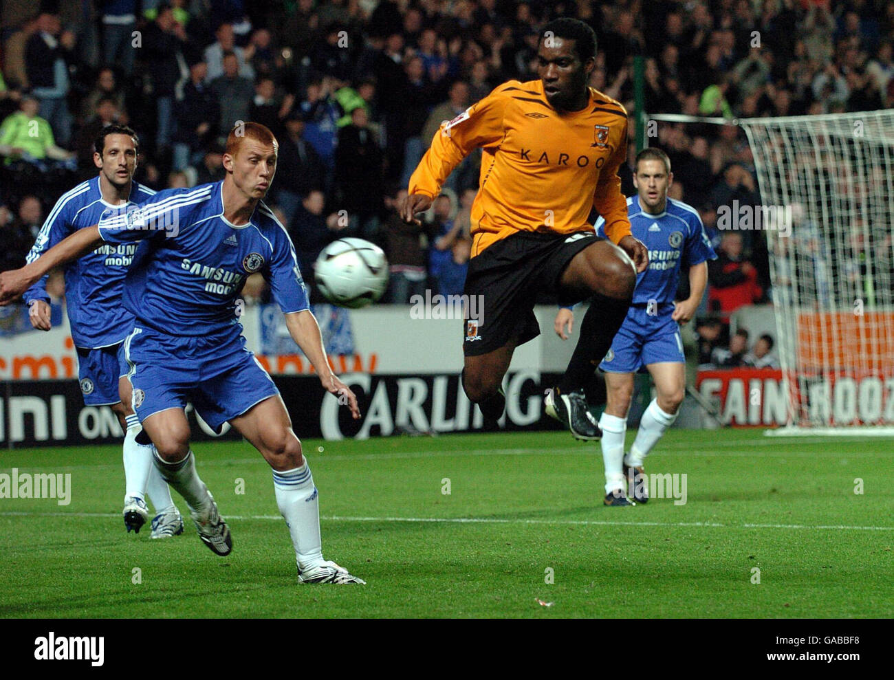 Hull City's Jay Jay Okocha (right) in action against Chelsea's Steve ...