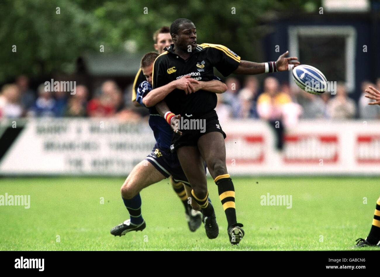 Sale Sharks' Charlie Hodgson (l) tries to tackle London Wasps' Martin ...