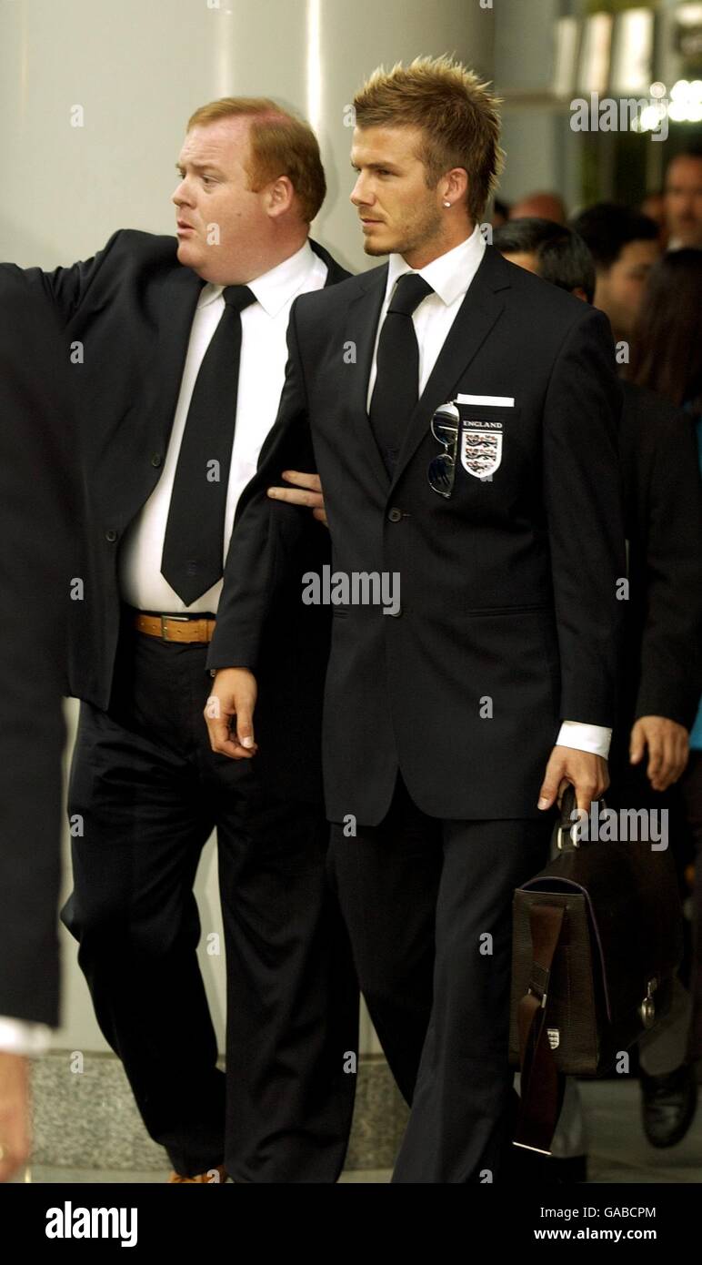England team security officer Ray Whitworth ushers David Beckham to the ...