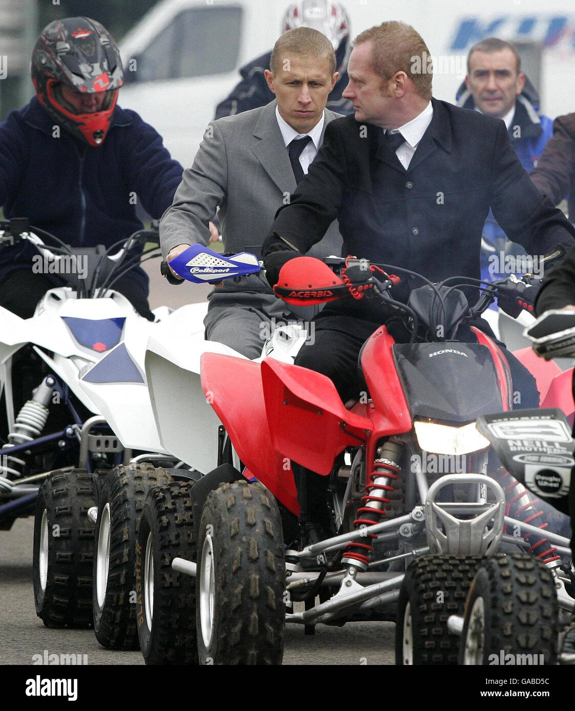 Alister McRae (grey suit) at the funeral of former quad bike champion ...