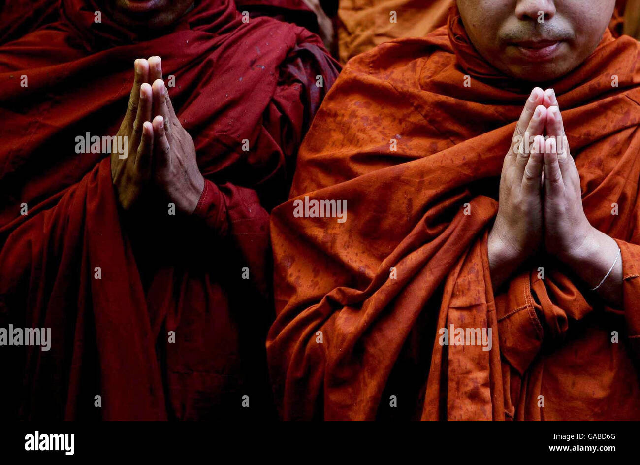 Buddhist monk clasped hands hi-res stock photography and images - Alamy