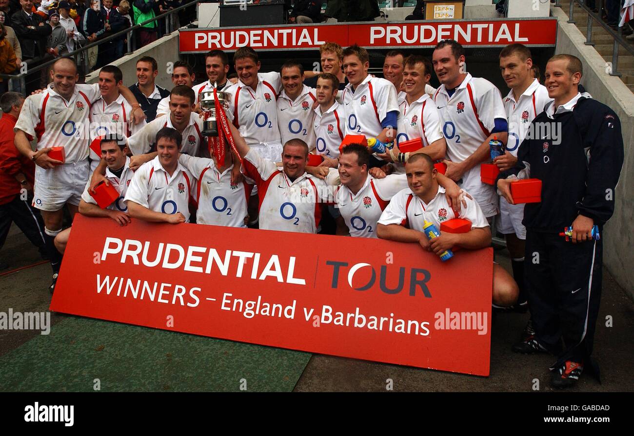 England celebrate with the winners trophy following their win over the ...