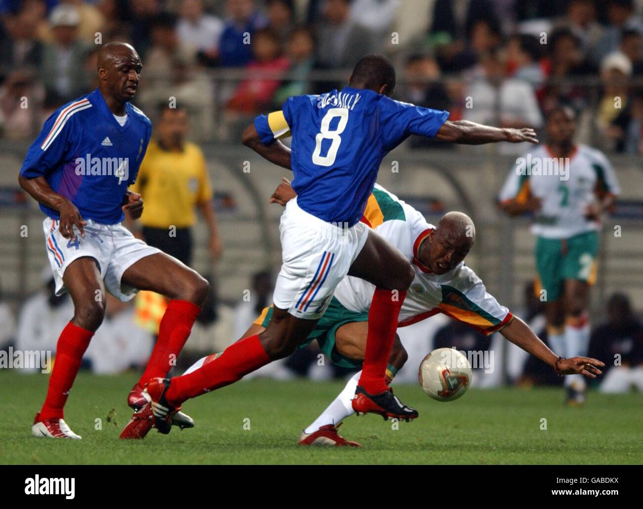 France's Marcel Desailly and Senegal's El Hadji Diouf battle for the ...
