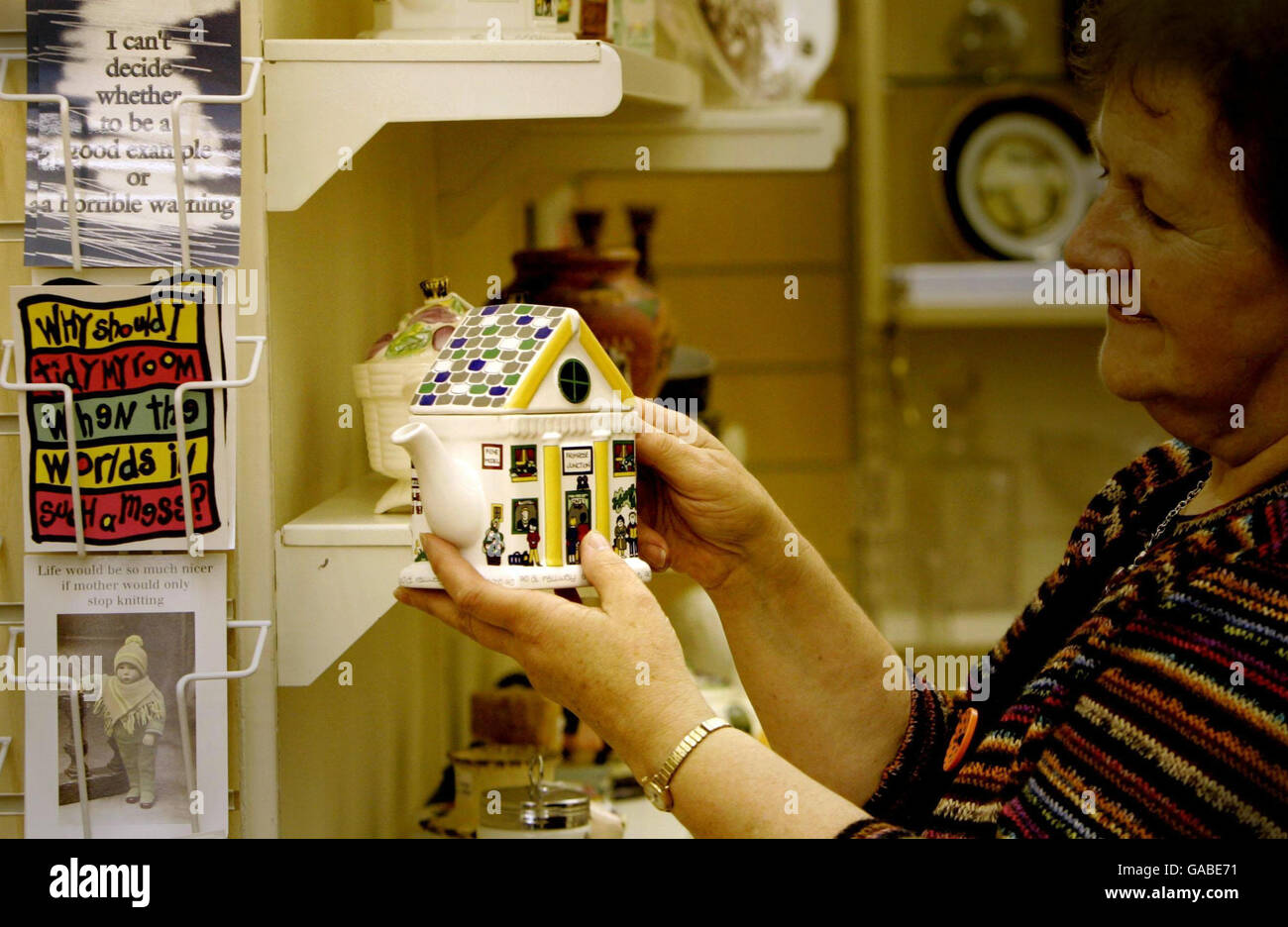 Manager of the shop Jan Tansley holds a teapot in the first Oxfam Shop ...