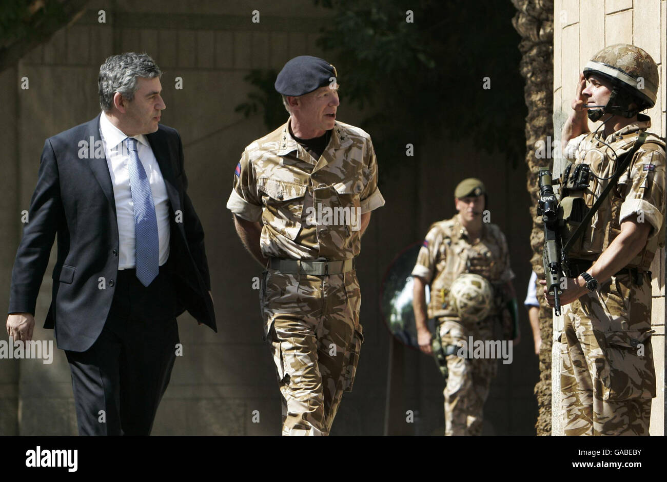 Britain's Prime Minister Gordon Brown, left, walks with British General ...