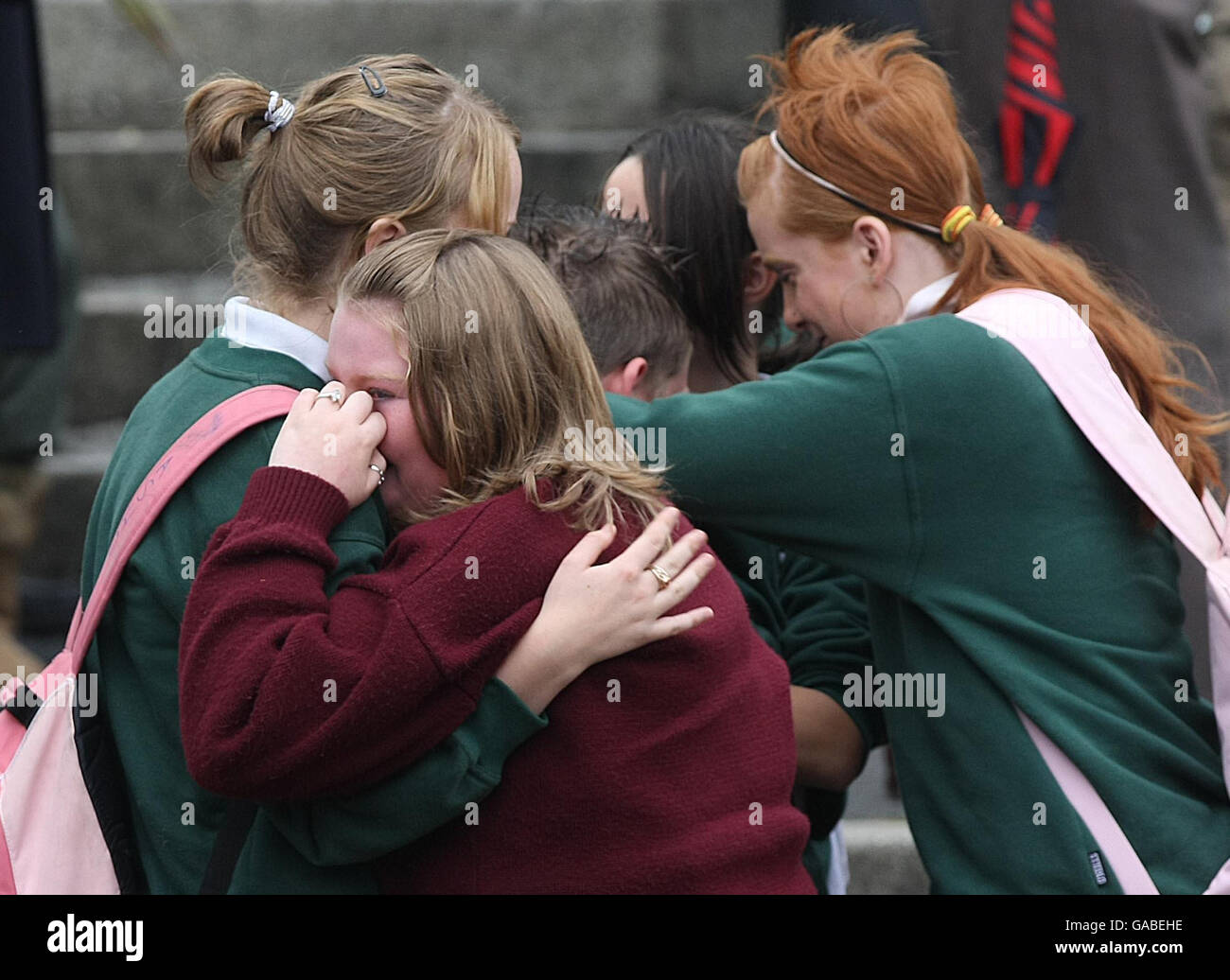 School children comfort each other at the funeral firefighter Brian ...