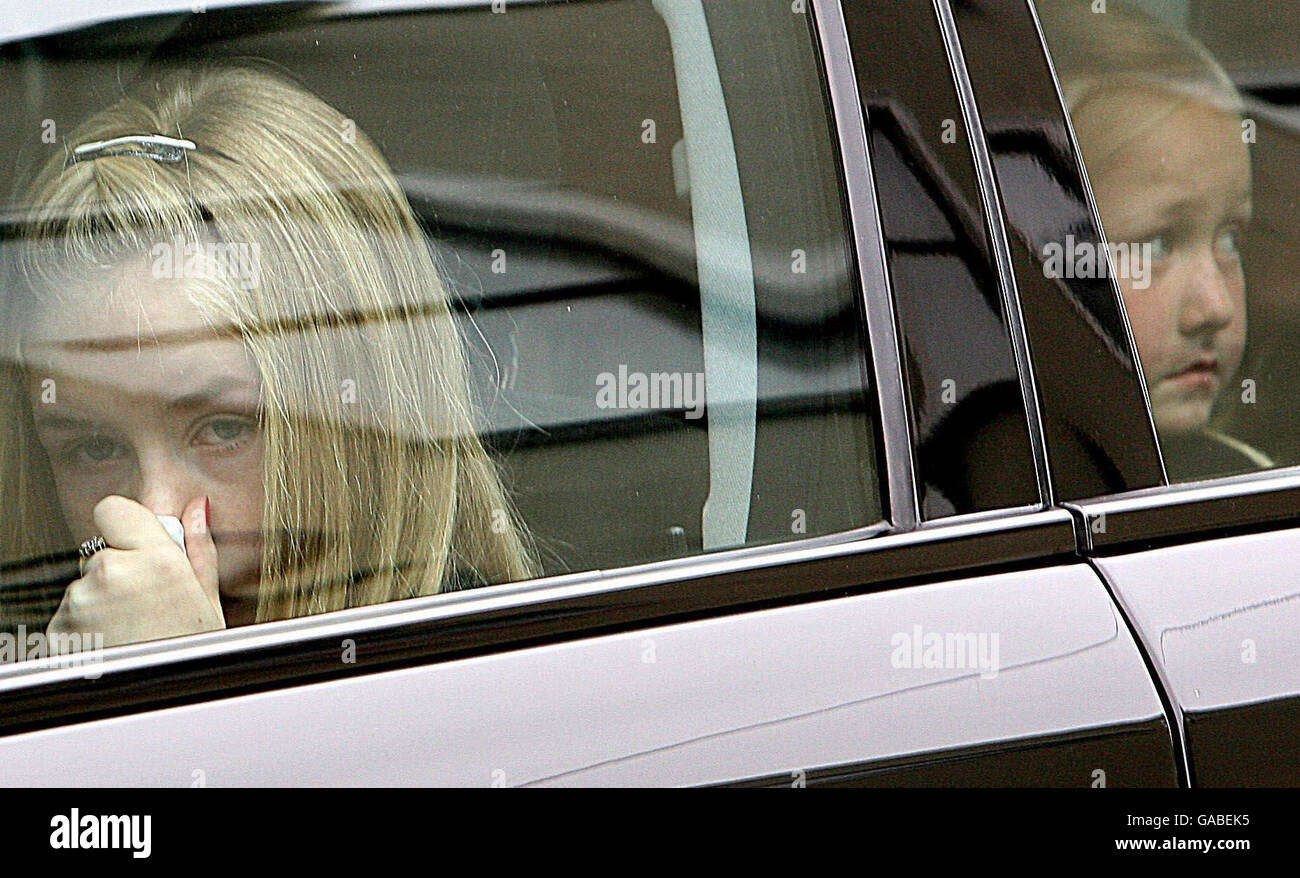 Family members leave in a limousine after the funeral of fireman Brian ...