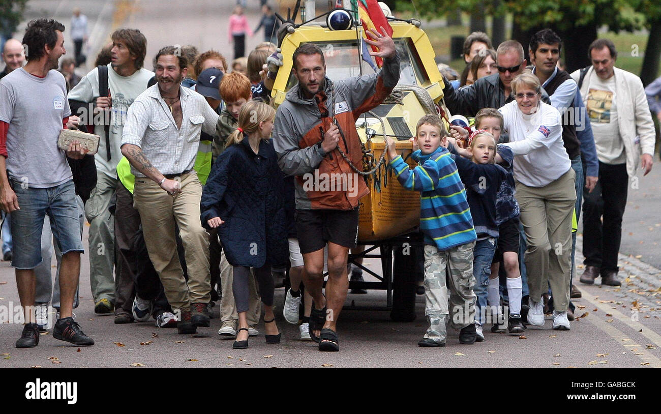 Jason Lewis pulls his boat after he finished his human powered around ...