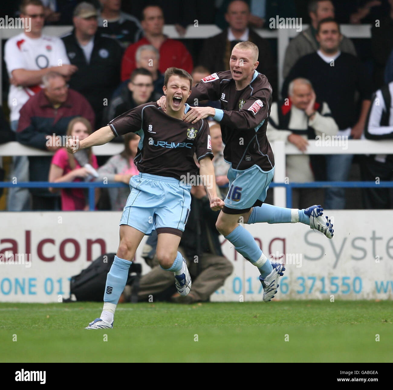 Bury's Nicky Adams (right) congratulates Andrew Mangan on scoring ...