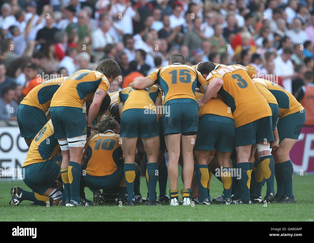 Australia players huddle together following their defeat against ...