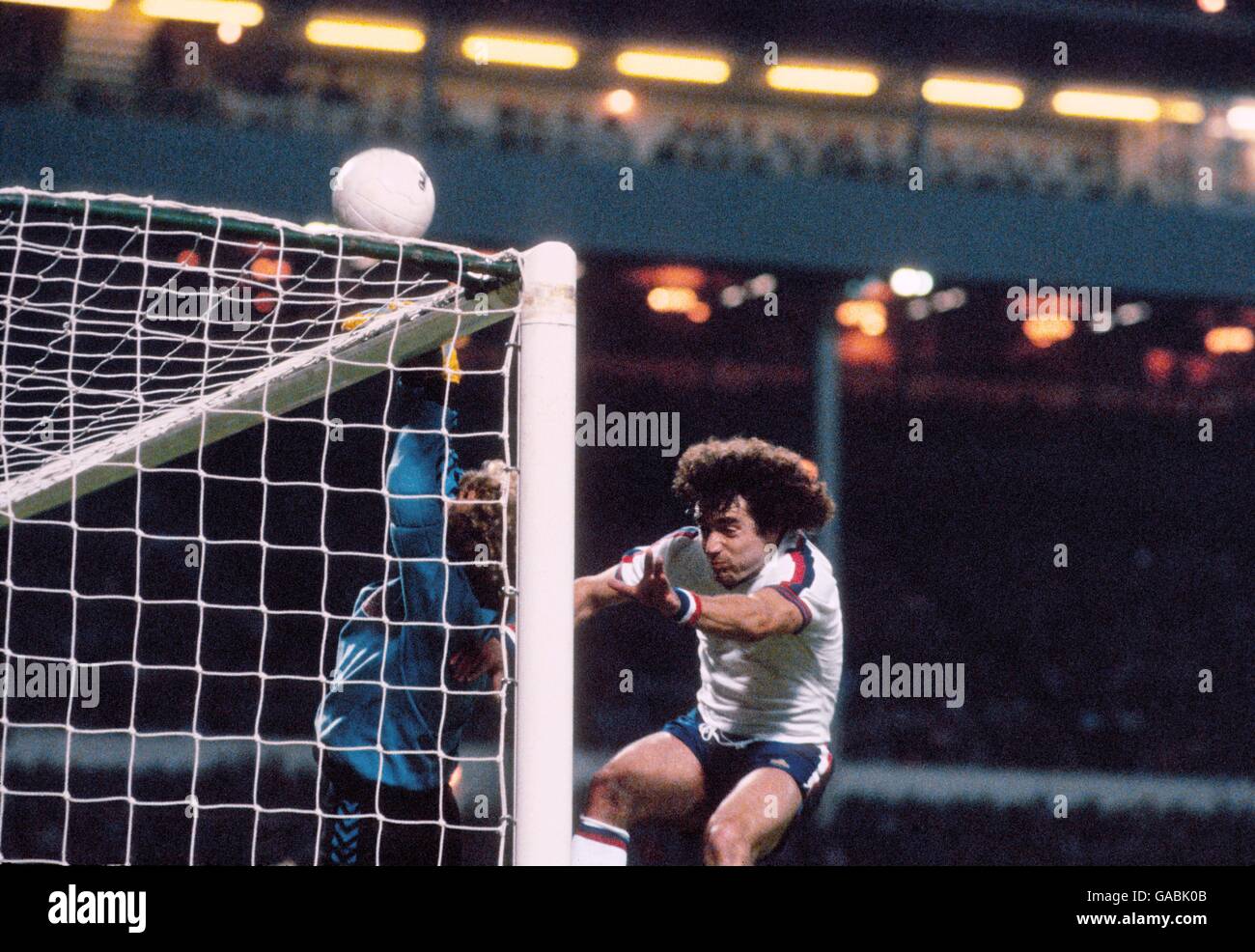 (L-R) The Denmark goalkeeper turns the ball over the bar as England's ...