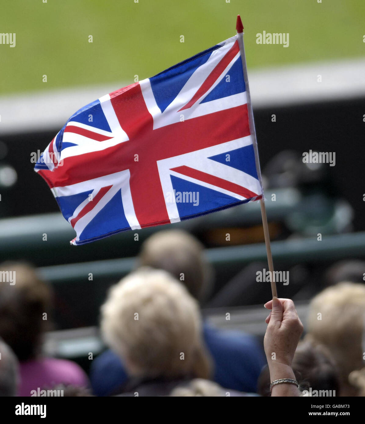 Hand waving british flag hi-res stock photography and images - Alamy