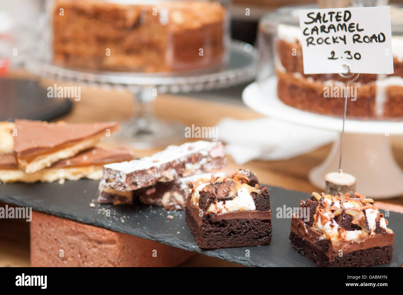 Freshly baked cakes and croissant inside a cafe Stock Photo - Alamy