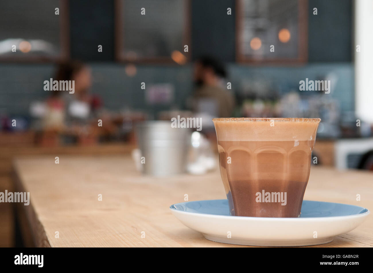 Cafe interior background with fresh coffee on the table in the coffee ...