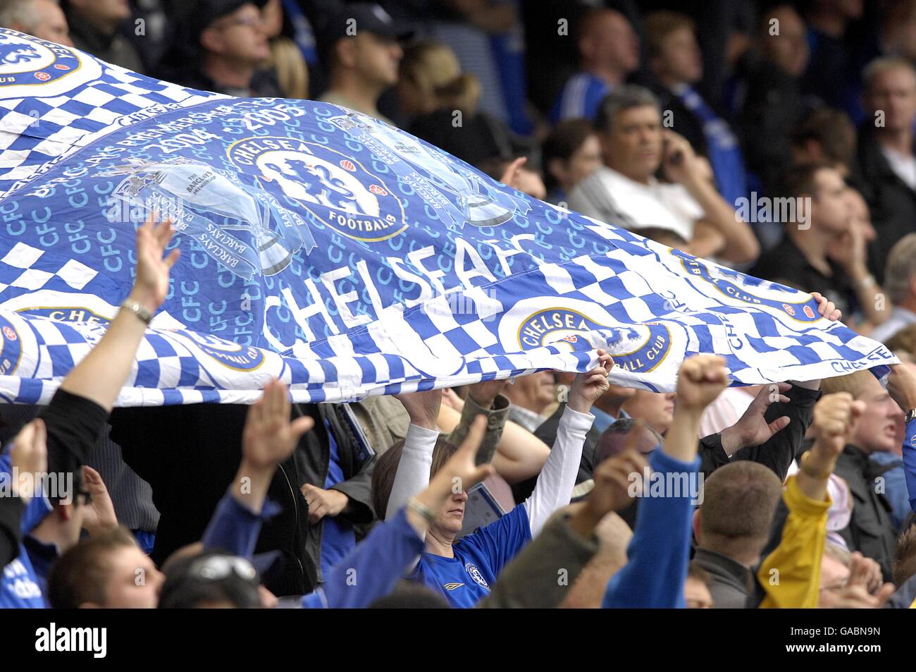 Chelsea fans with a flag in the stands hi-res stock photography and ...