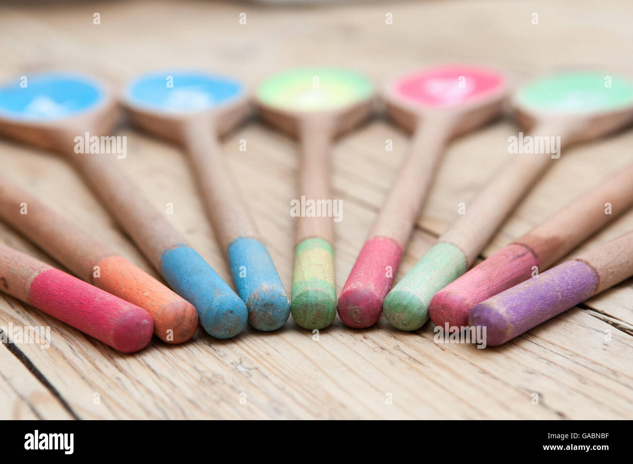 Brightly colored wooden spoons with numbers in a sequence arranged in a ...