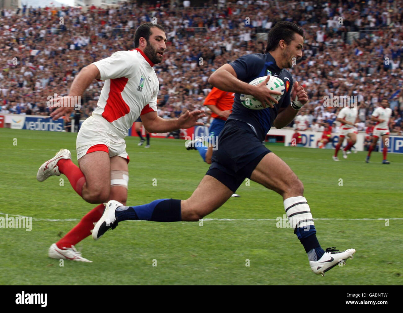 France's Clement Poitrenaud goes on to score the first try during the ...