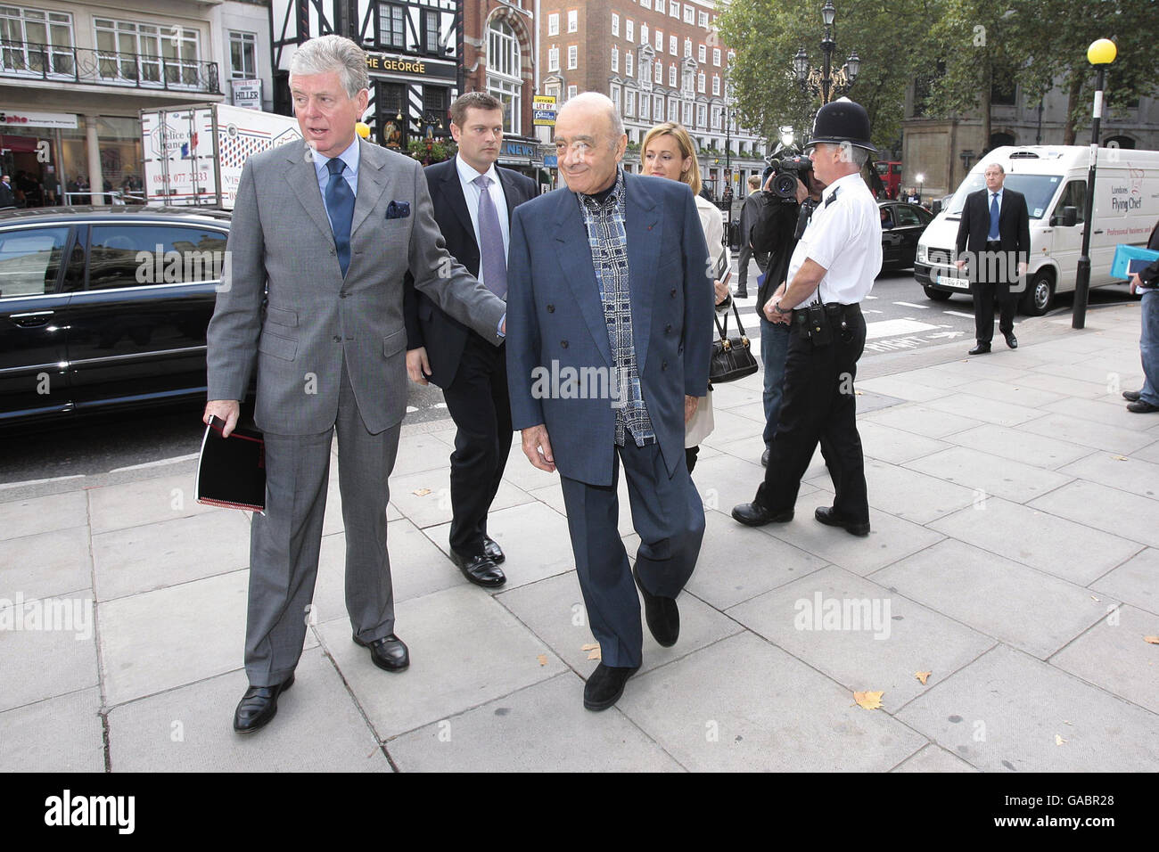 Mohamed al Fayed (centre), with his assistant Michael Cole (left ...