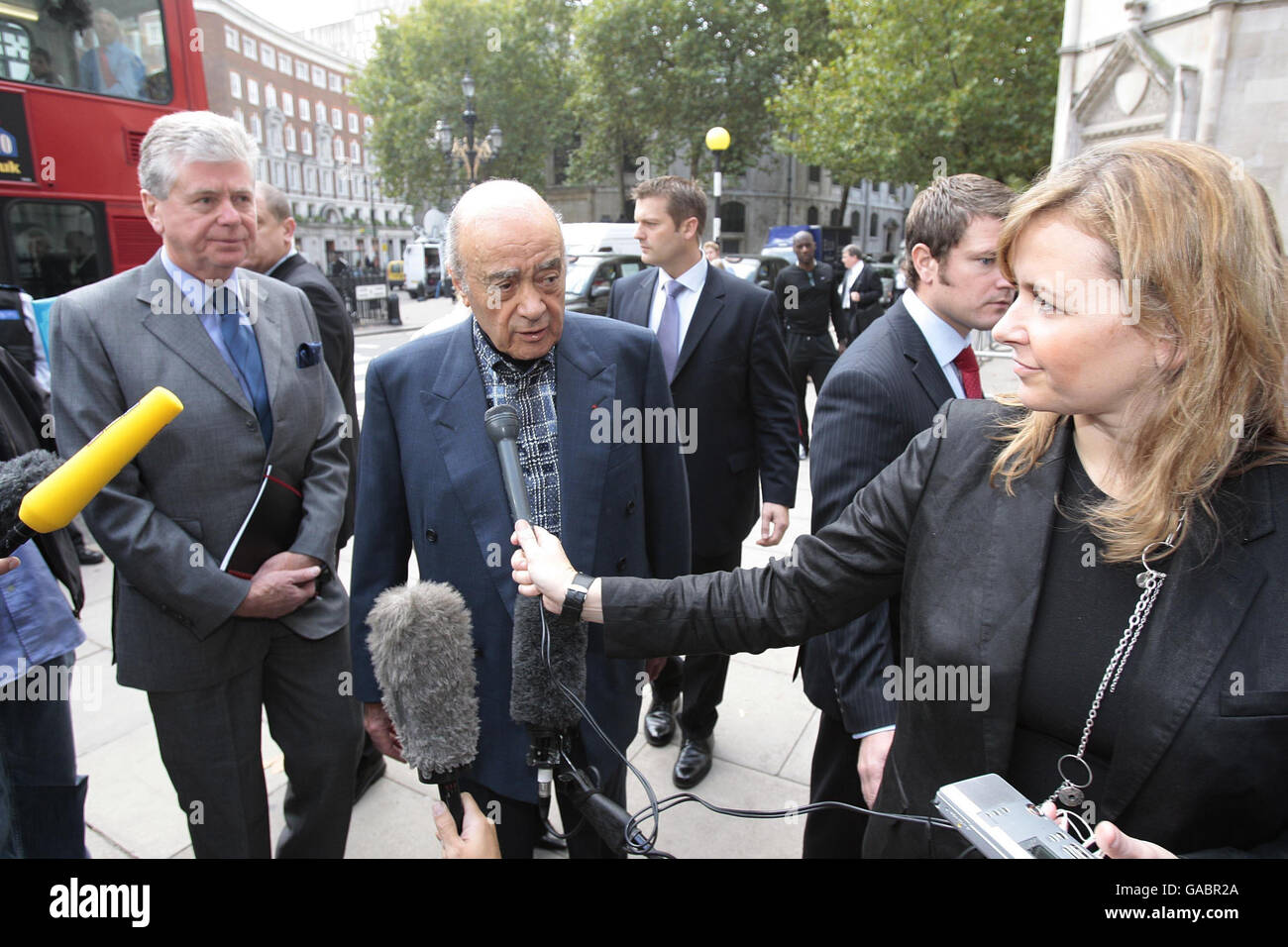 Mohamed al Fayed (centre), with his assistant Michael Cole (left ...