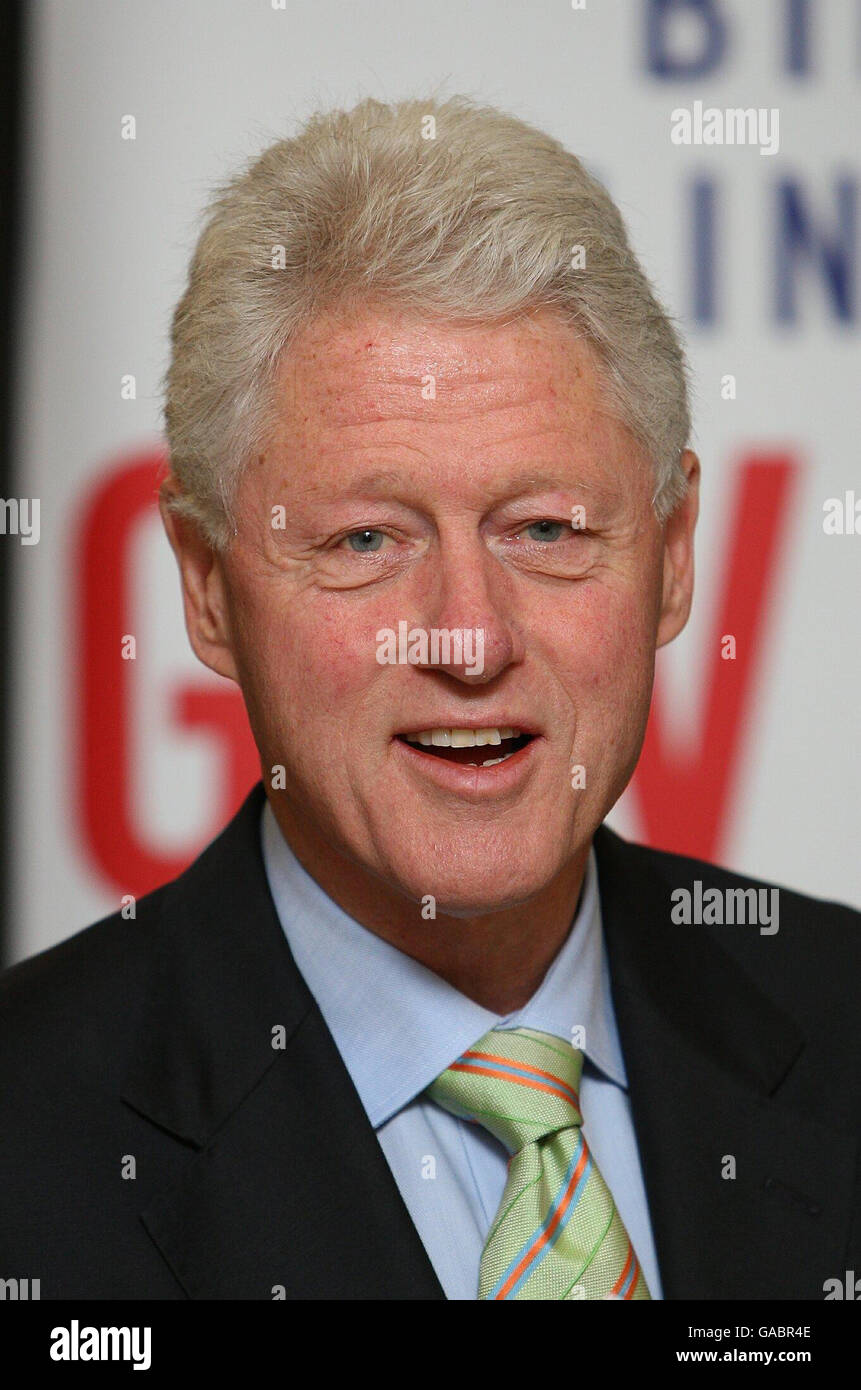 former US President Bill Clinton signs copies of his new book, 'Giving ...