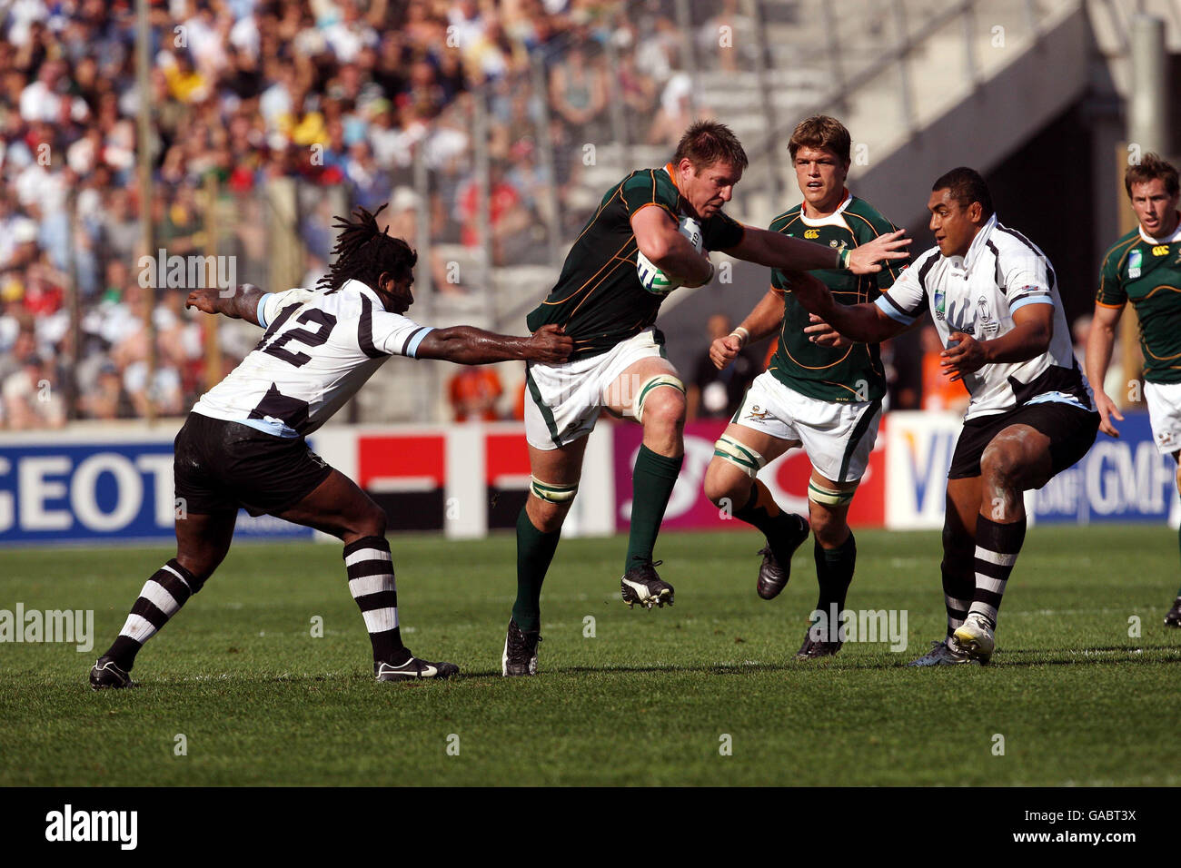 South Africa's Bakkies Botha charges at Fiji's Seru Rabeni during the ...