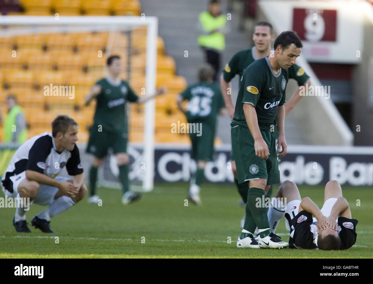 Winning goal scorer Scott McDonald of Celtic goes to console Evan ...