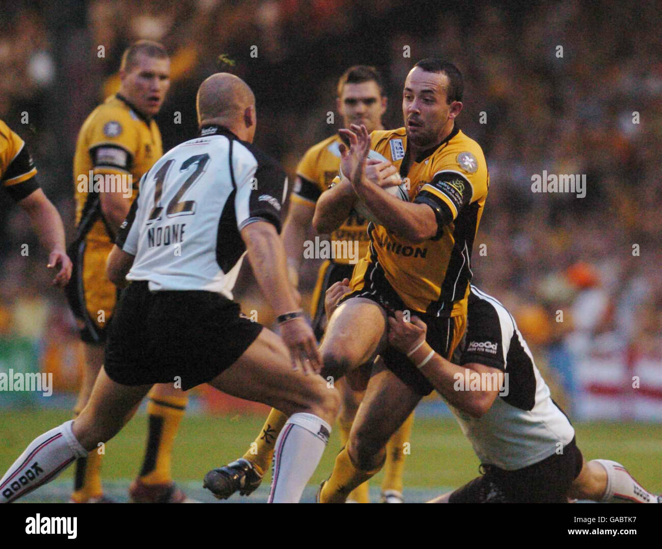 Castleford's Ryan Clayton is stopped by the Widnes defence during the ...