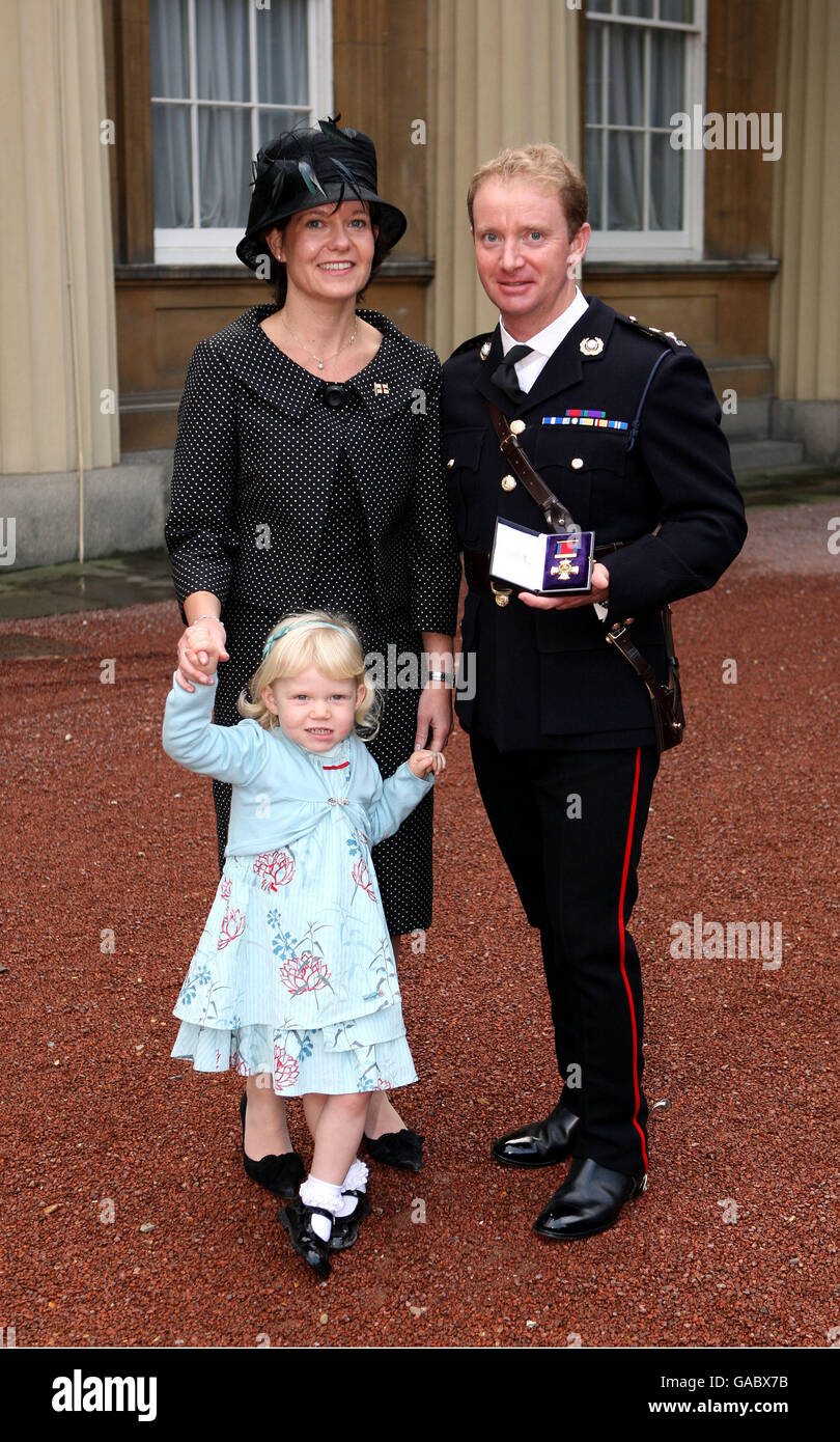 Royal Marine Lt Col Matthew Holmes with his wife Lea and daughter ...