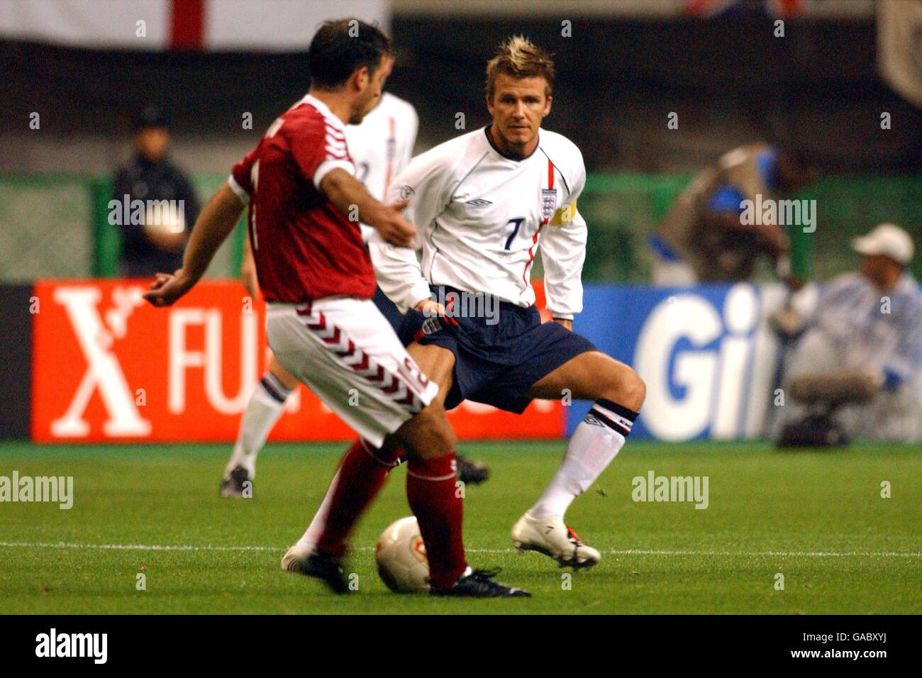 Denmark's Niclas Jensen (l) clears the danger from England's David ...