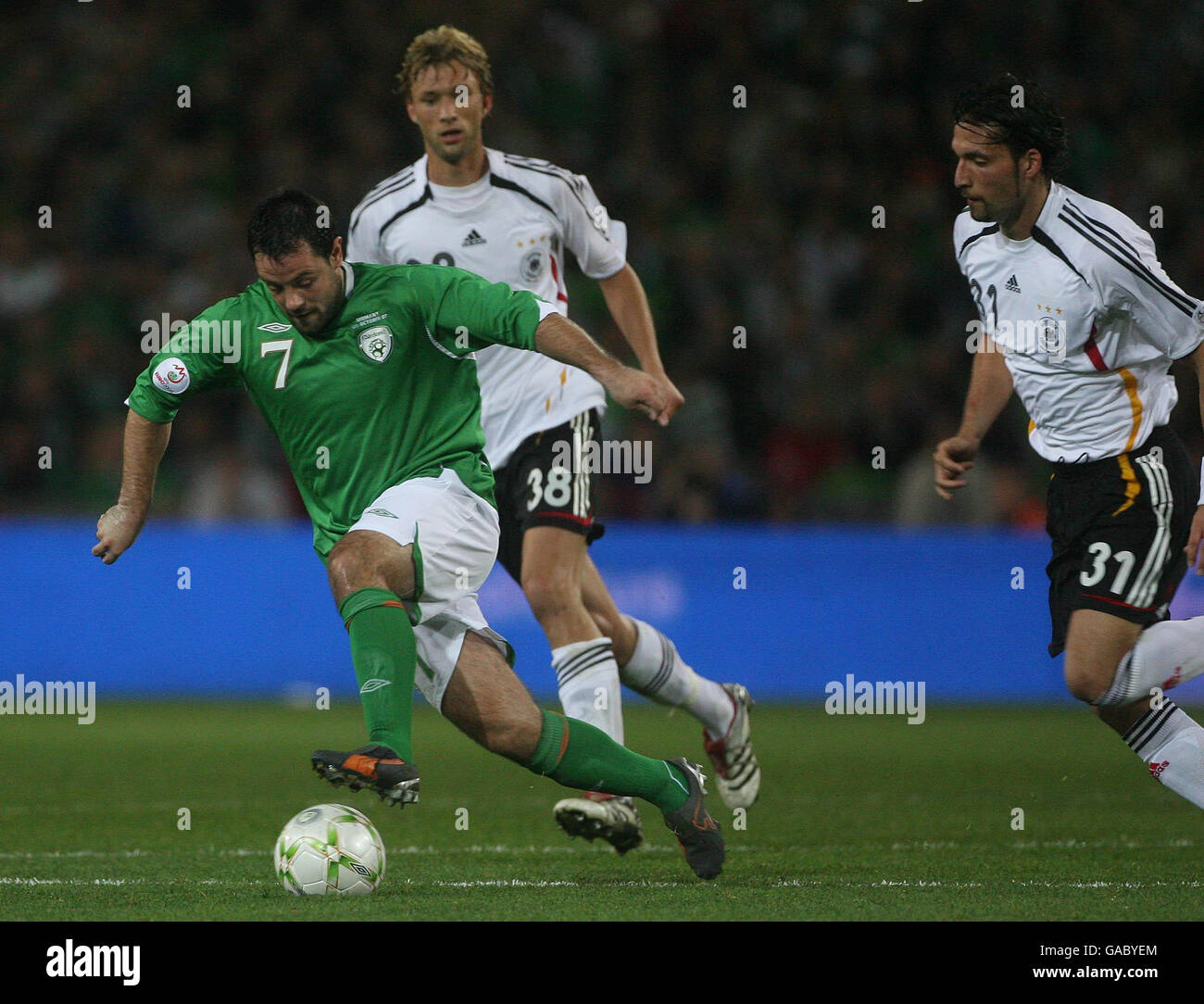 Andy Reid (left) of the Republic of Ireland out runs Simon Rolfes and ...