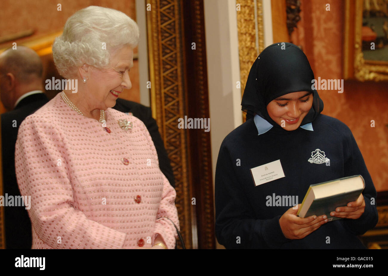 Queen Elizabeth II presents 14 year-old Zainab Ahmed, from Sarah ...