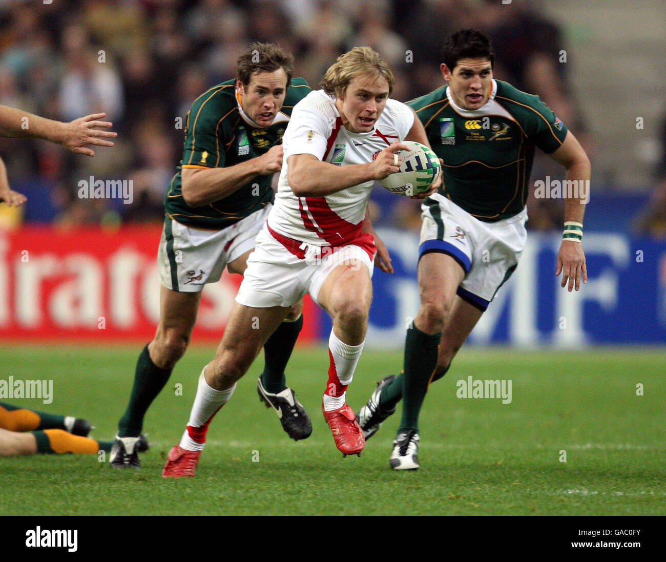 England Matthew Tait leaves South Africa's Butch James and Jaque Fourie ...