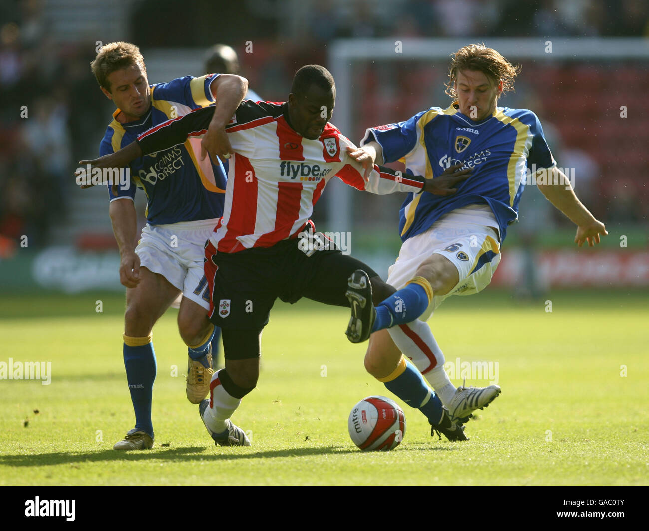 Southampton's Stern John is sandwiched between Cardiff City's Steven ...