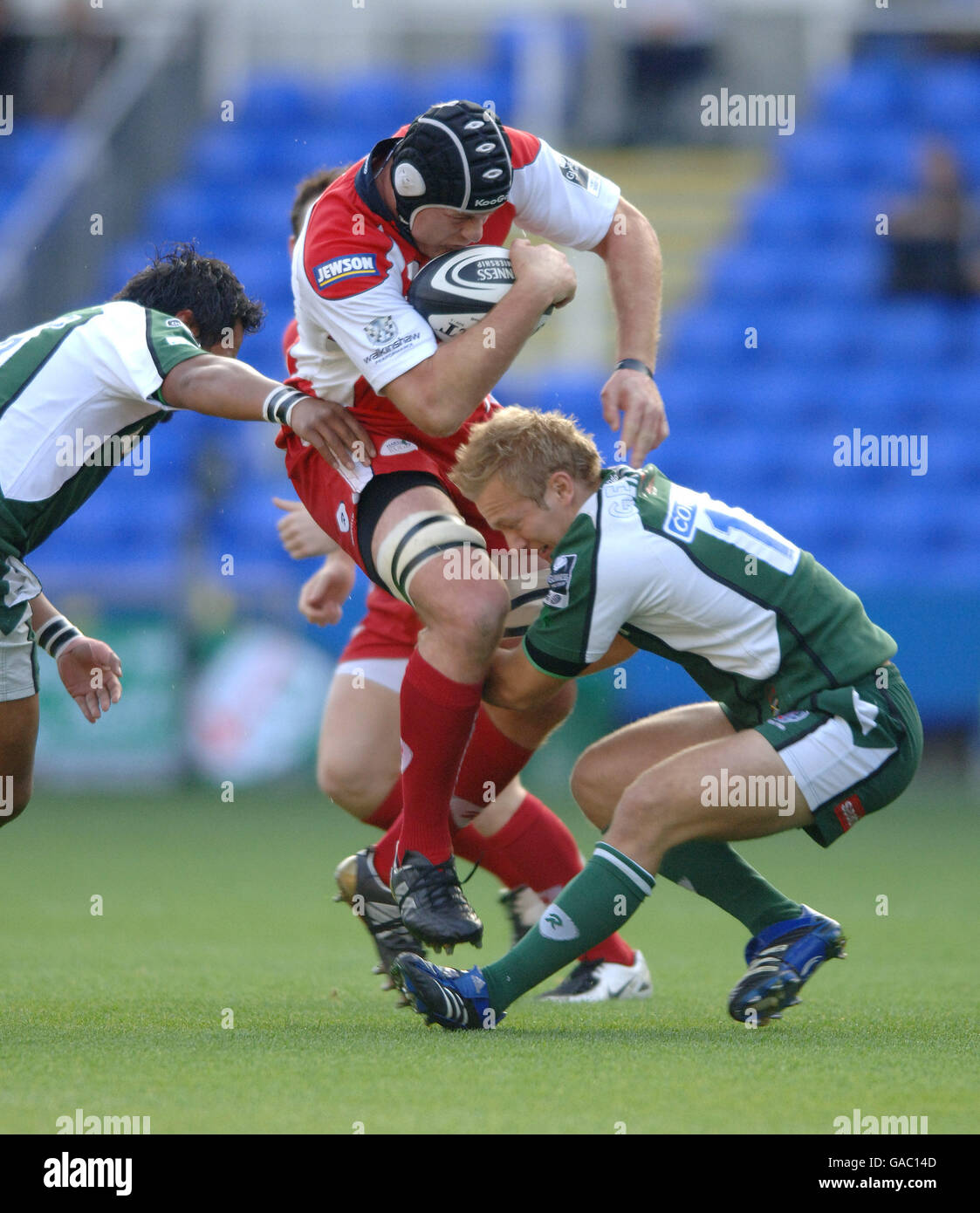 London Irish's Shane Geraghty tackles Gloucester Rugby's Peter Buxton ...