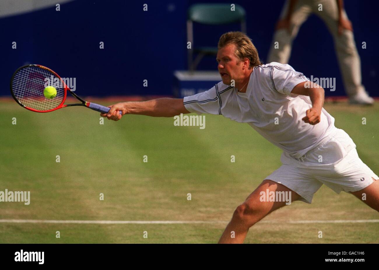 Magnus Larsson, Sweden in action against Greg Rusedski Stock Photo - Alamy