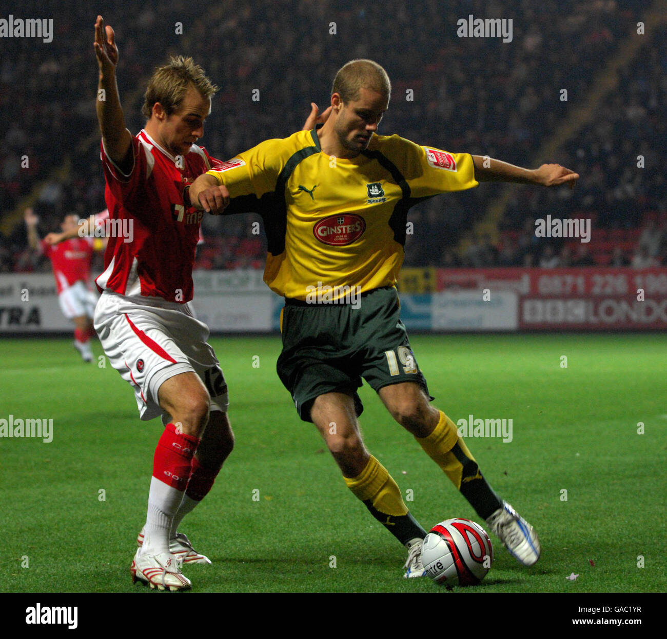 Plymouth's Marcel Seip and Charlton's Luke Varney battle Stock Photo ...