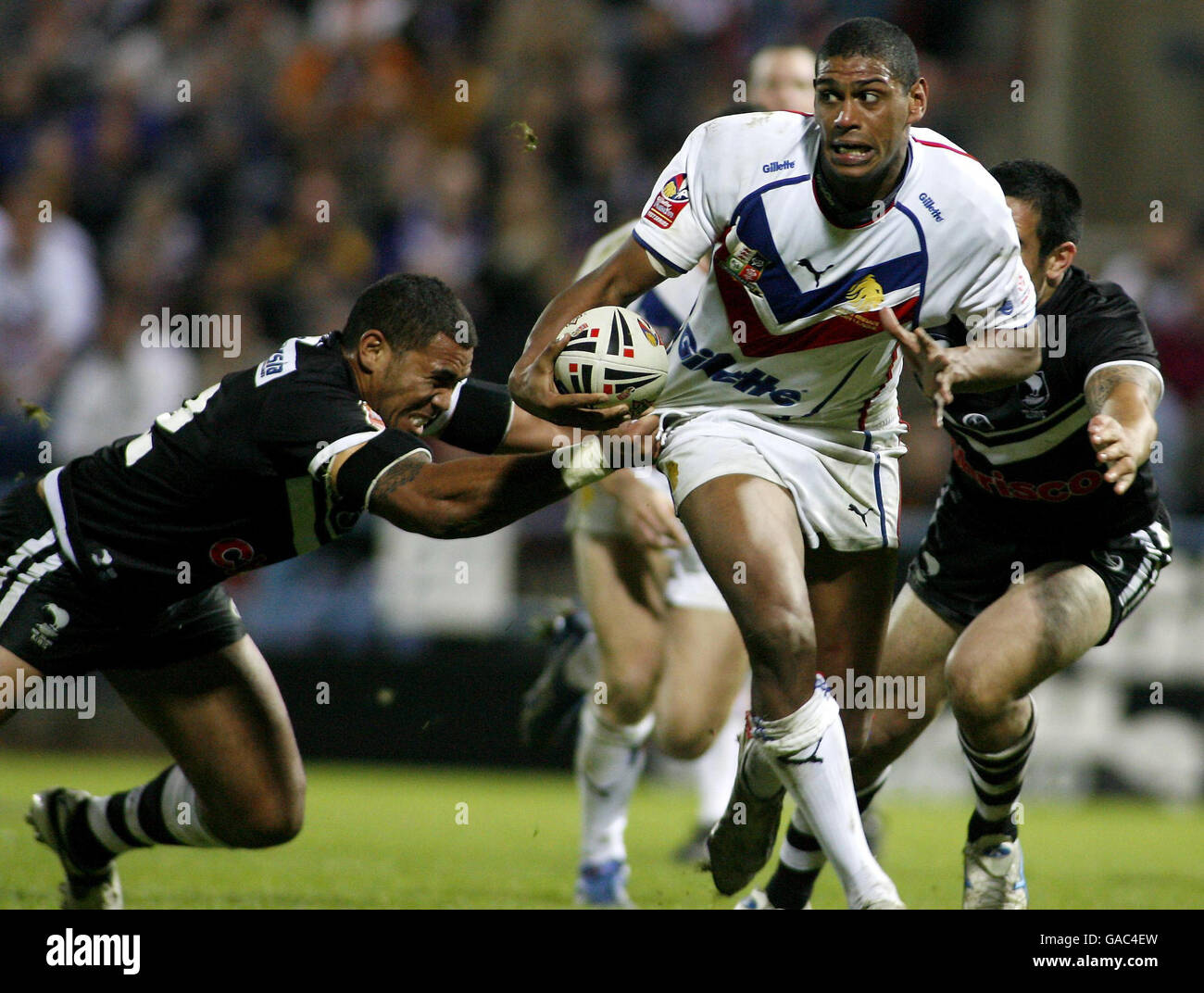 Great Britain's Leon Pryce is caught by New Zealand's Frank Pritchard ...