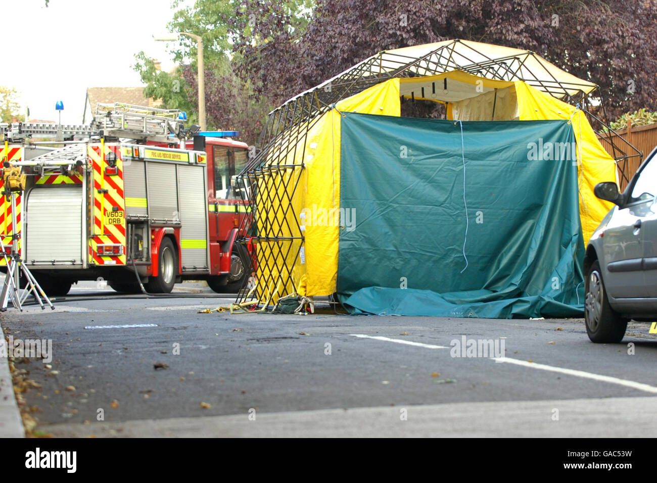 A fire engine is seen next to a forensics tent after a man's body was ...