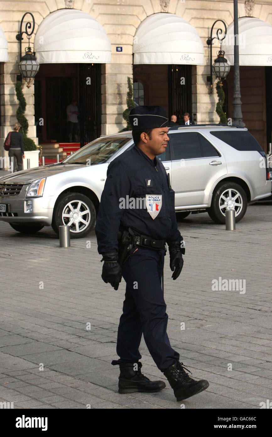 A French policeman patrols outside the Ritz Hotel in Paris prior to the ...