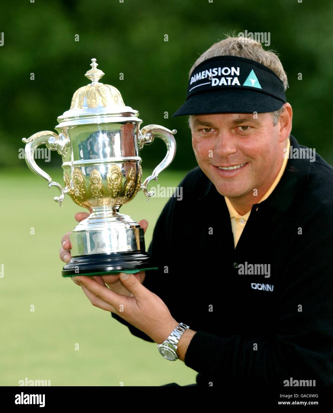 Darren Clarke celebrates with the trophy after winning The English Open ...