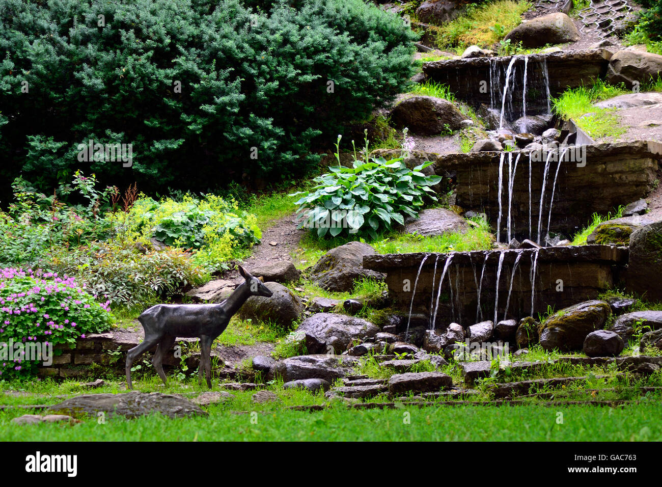 Waterfalls and statue of roe Stock Photo - Alamy