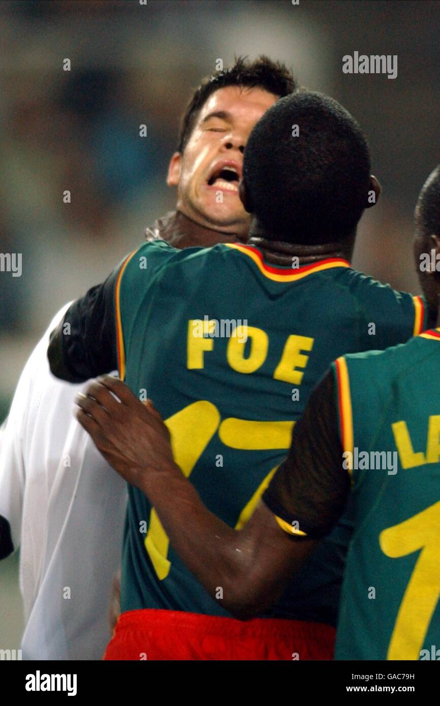 Cameroons marc vivien foe gets germanys michael ballack by the hi-res ...