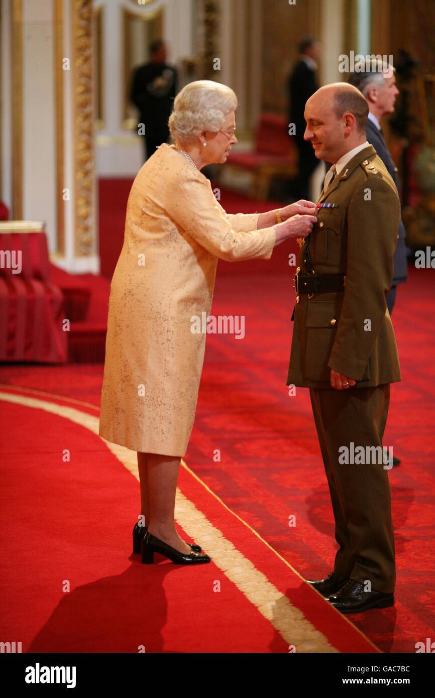 Receives an obe from the queen at buckingham palace hi-res stock ...